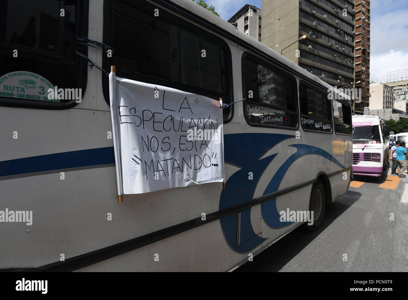 Caracas, Miranda, Venezuela. 3rd Aug, 2018. A bus is seen with a poster ...