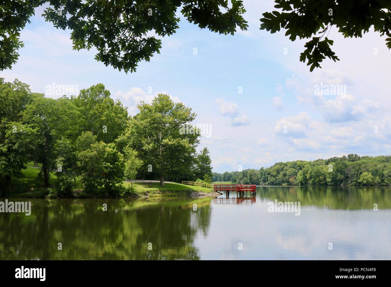 Lake reflecting the spring colors in Kentucky Stock Photo - Alamy