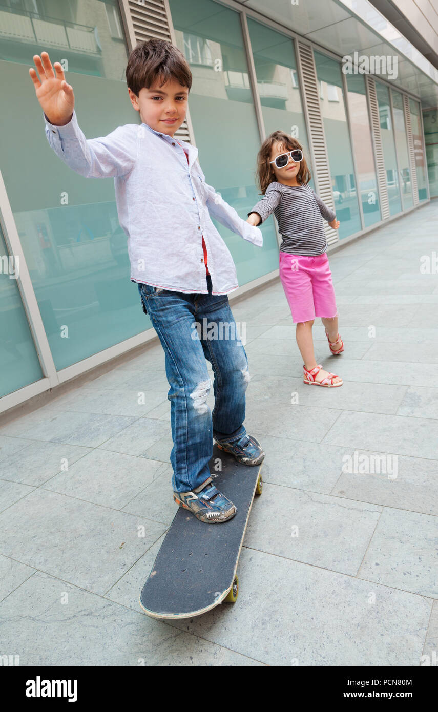portrait of two children on the sidewalk Stock Photo - Alamy