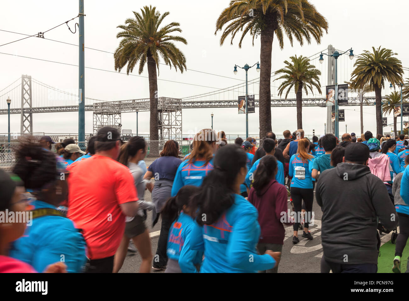 Runners for 5K race at the starting point, with the Bay Bridge in ...