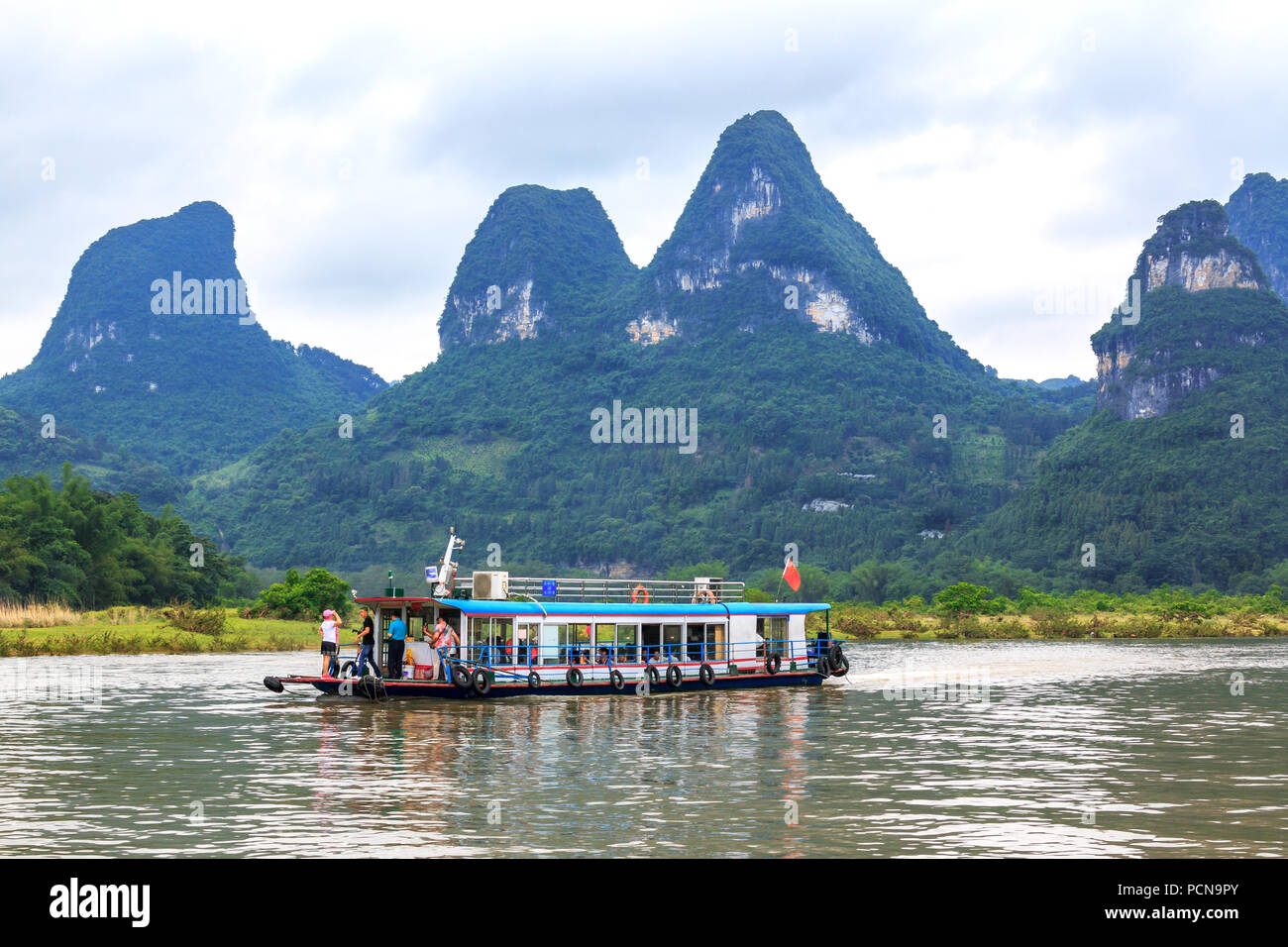 Karst peaks in Xingping Town and pleasure boat on the Li River Stock ...