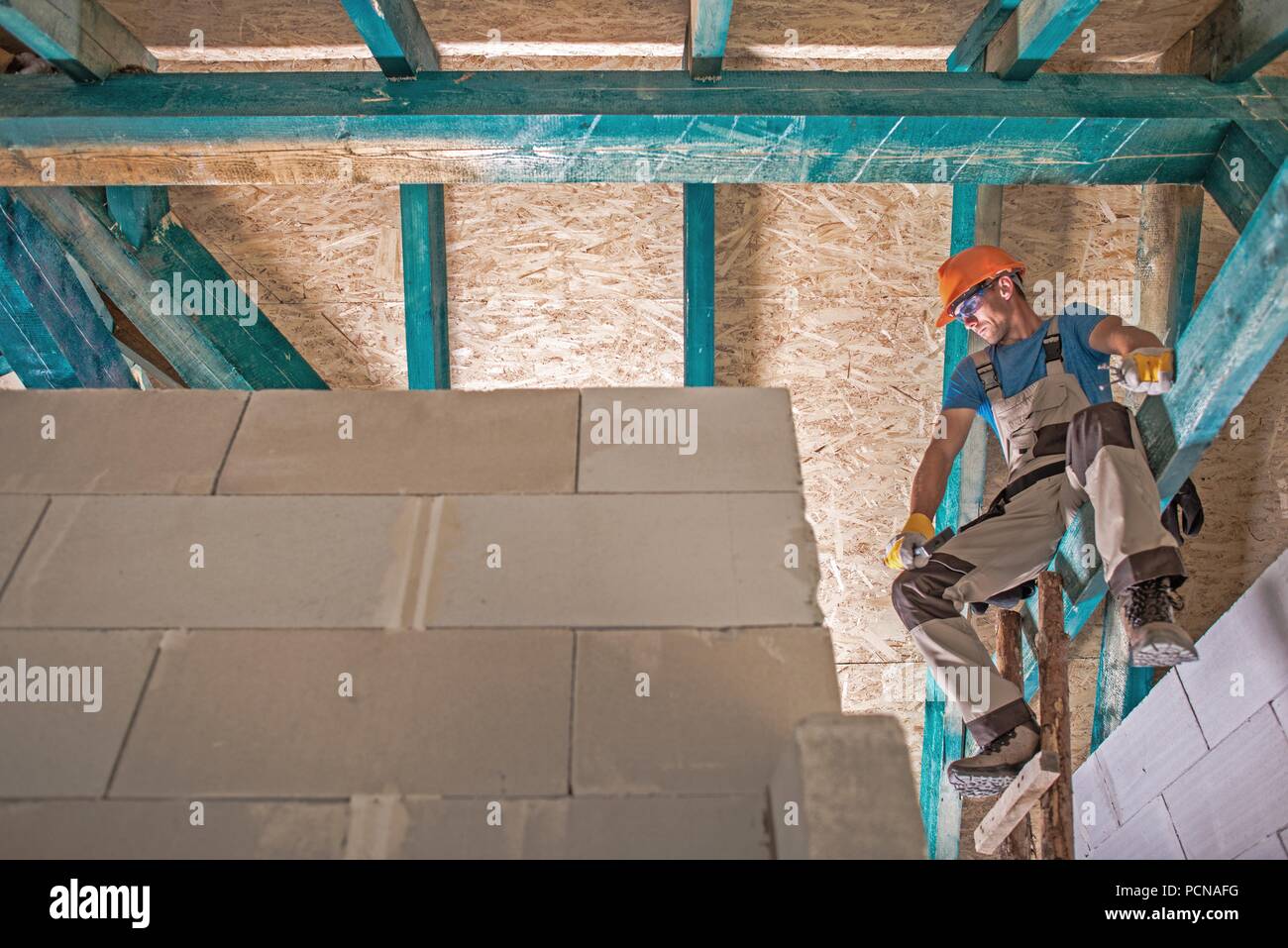 Contractor and the Construction Site. Caucasian Worker Seating on the ...