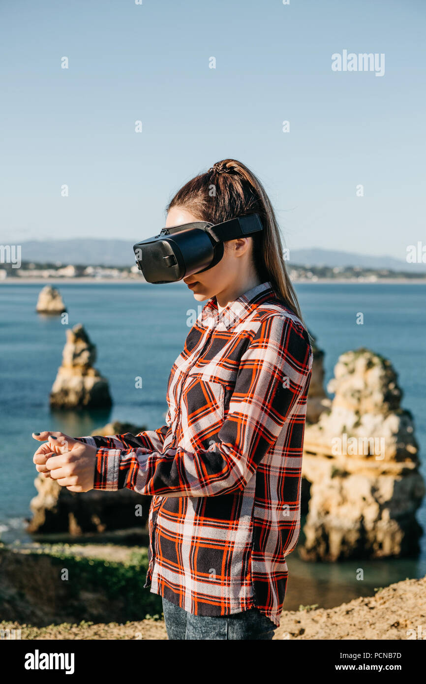 The girl in glasses of a virtual reality. Modern technology in everyday ...
