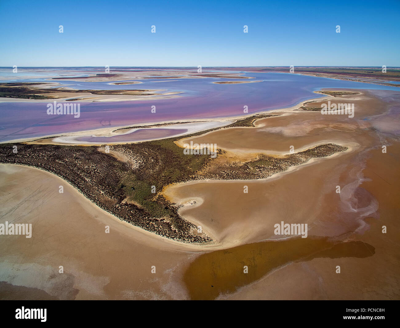 Aerial landscape of shallow pink salt lake Tyrrell in Victoria ...