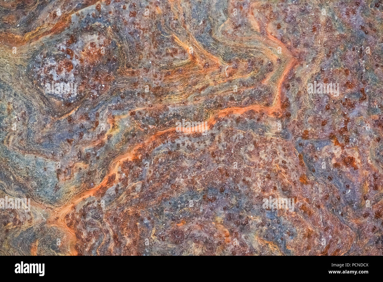 Closeup of corroded metal board due to a long term oxidation process ...