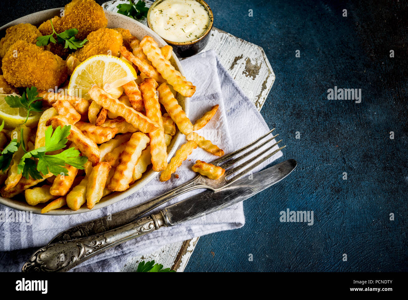 English traditional fast food, junk food, British dish Fish and chips ...