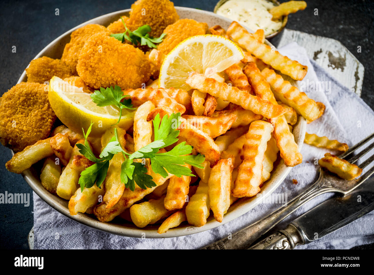 English traditional fast food, junk food, British dish Fish and chips ...