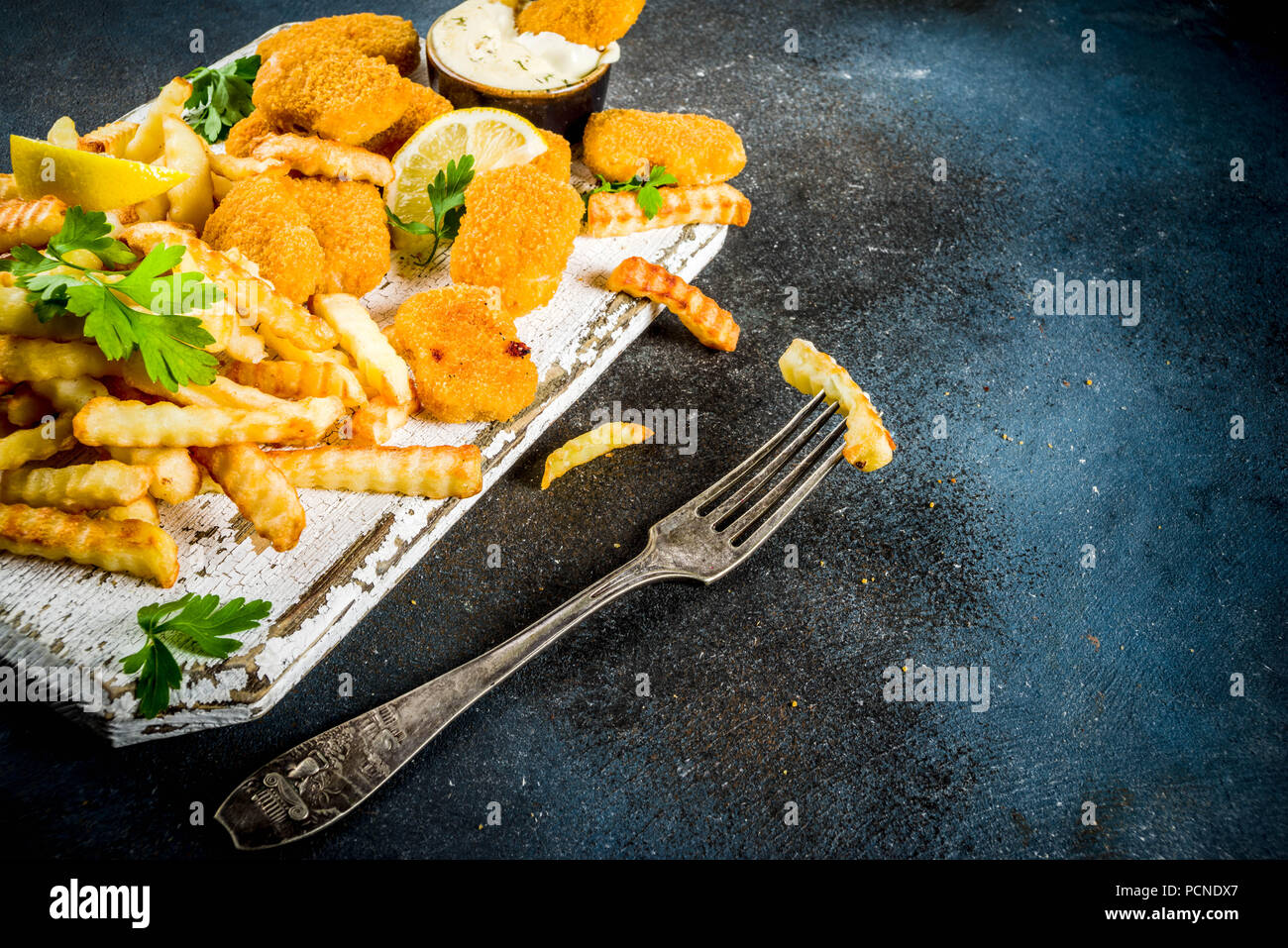 English traditional fast food, junk food, British dish Fish and chips ...