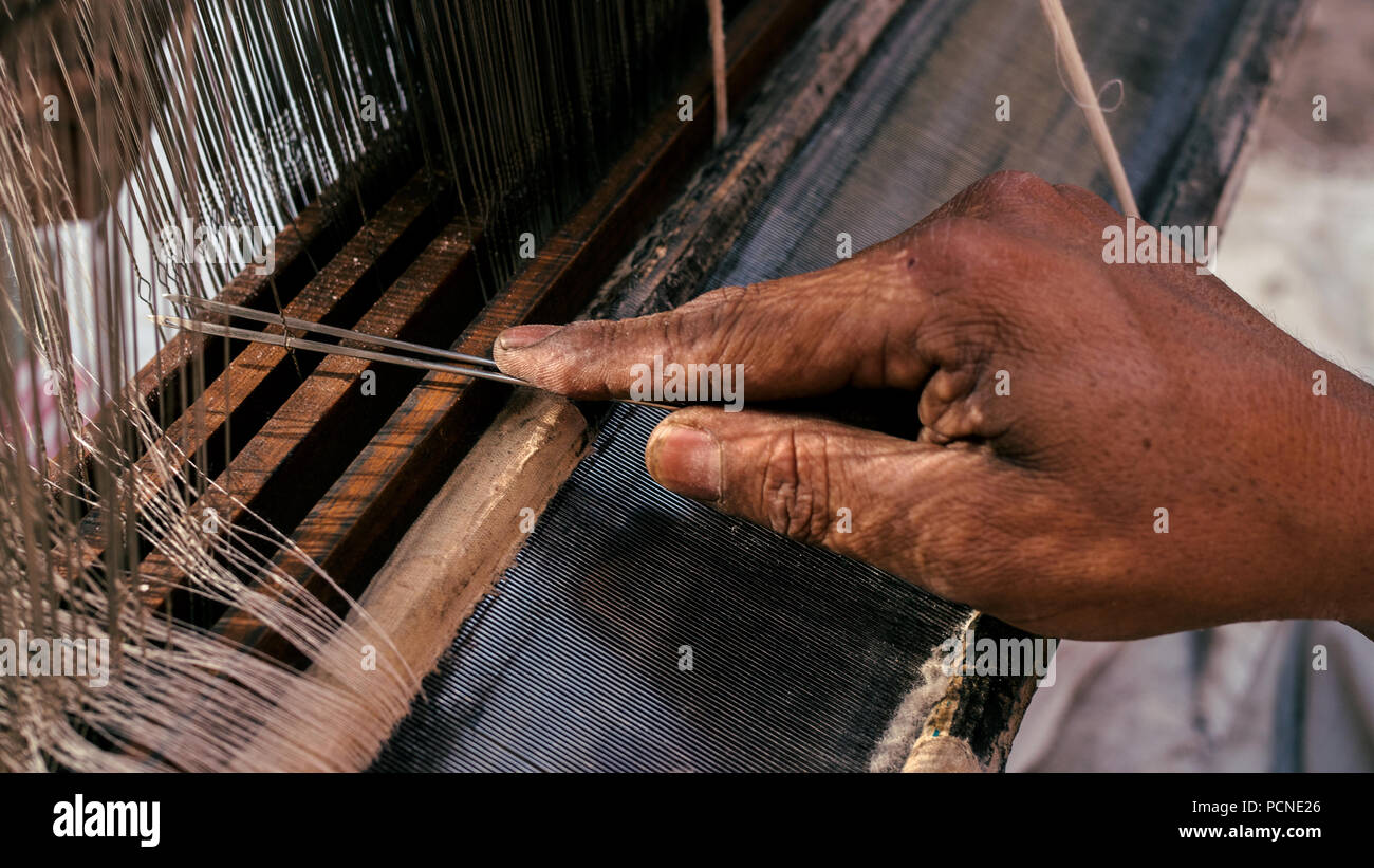 Repairing a broken loom Stock Photo - Alamy