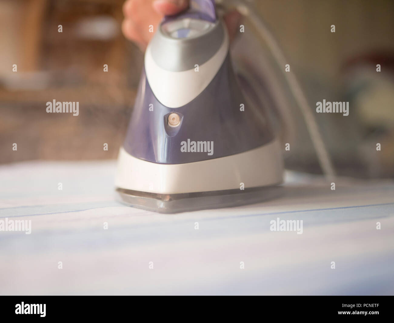 Woman ironing bed hi-res stock photography and images - Alamy