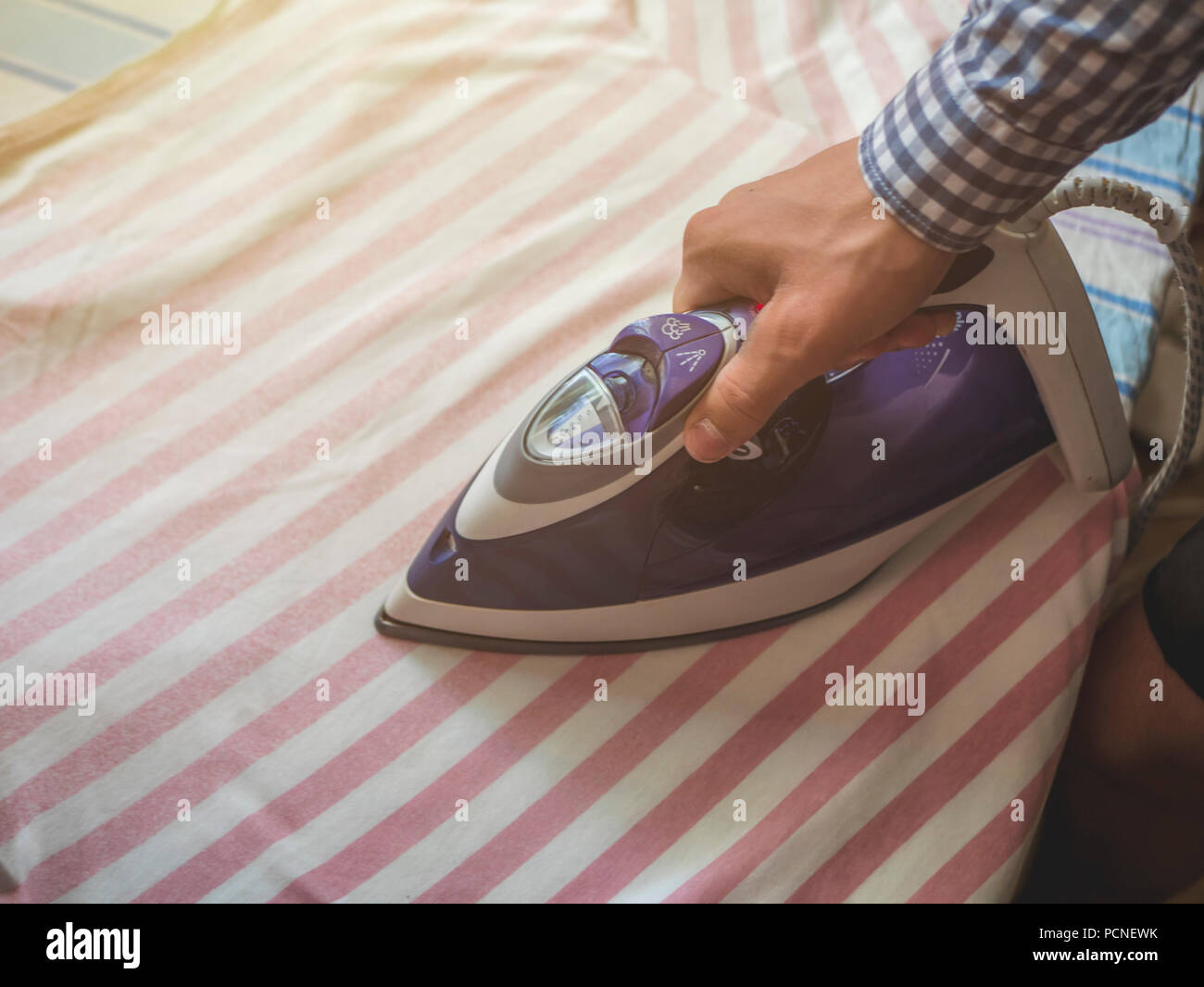 close up maid ironing clothes in hotel in cozy room Stock Photo - Alamy