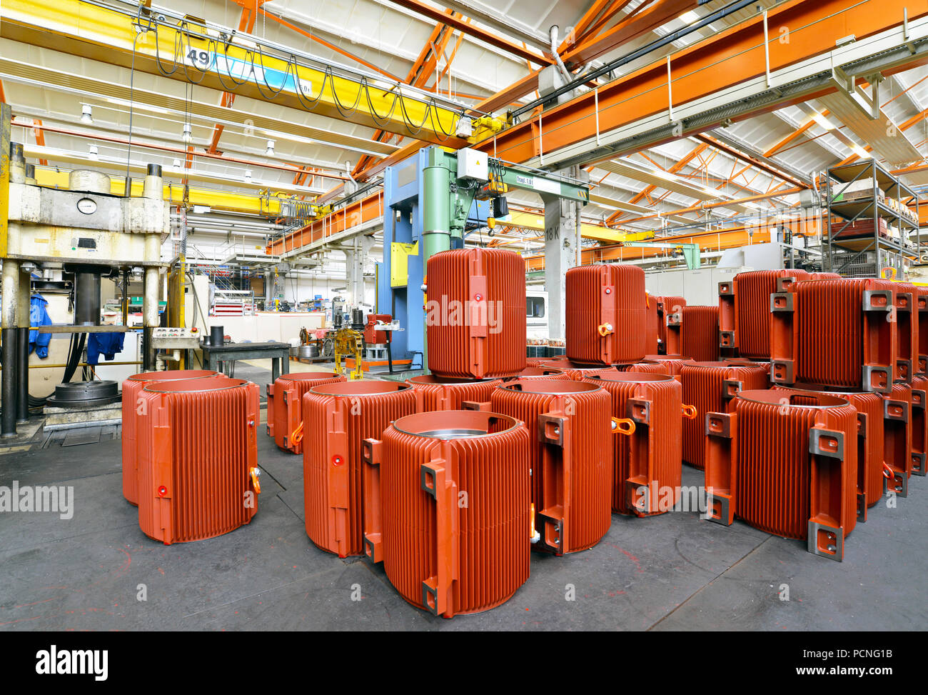 mechanical engineering: closeup of electric motors in production in a ...