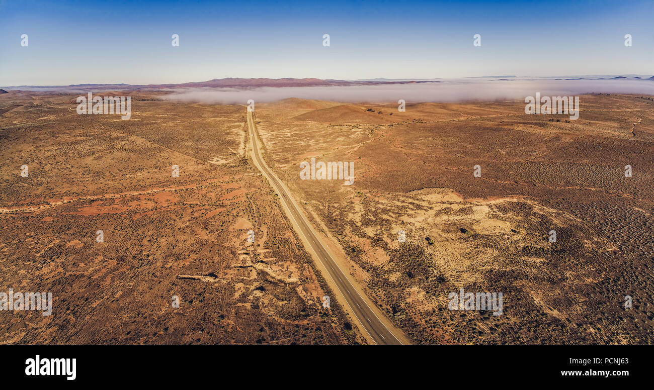 Countryside highway passing through Australian outback desert leading ...