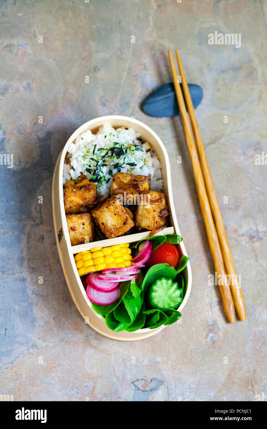 Crispy tofu with rice and salad in bento box Stock Photo - Alamy