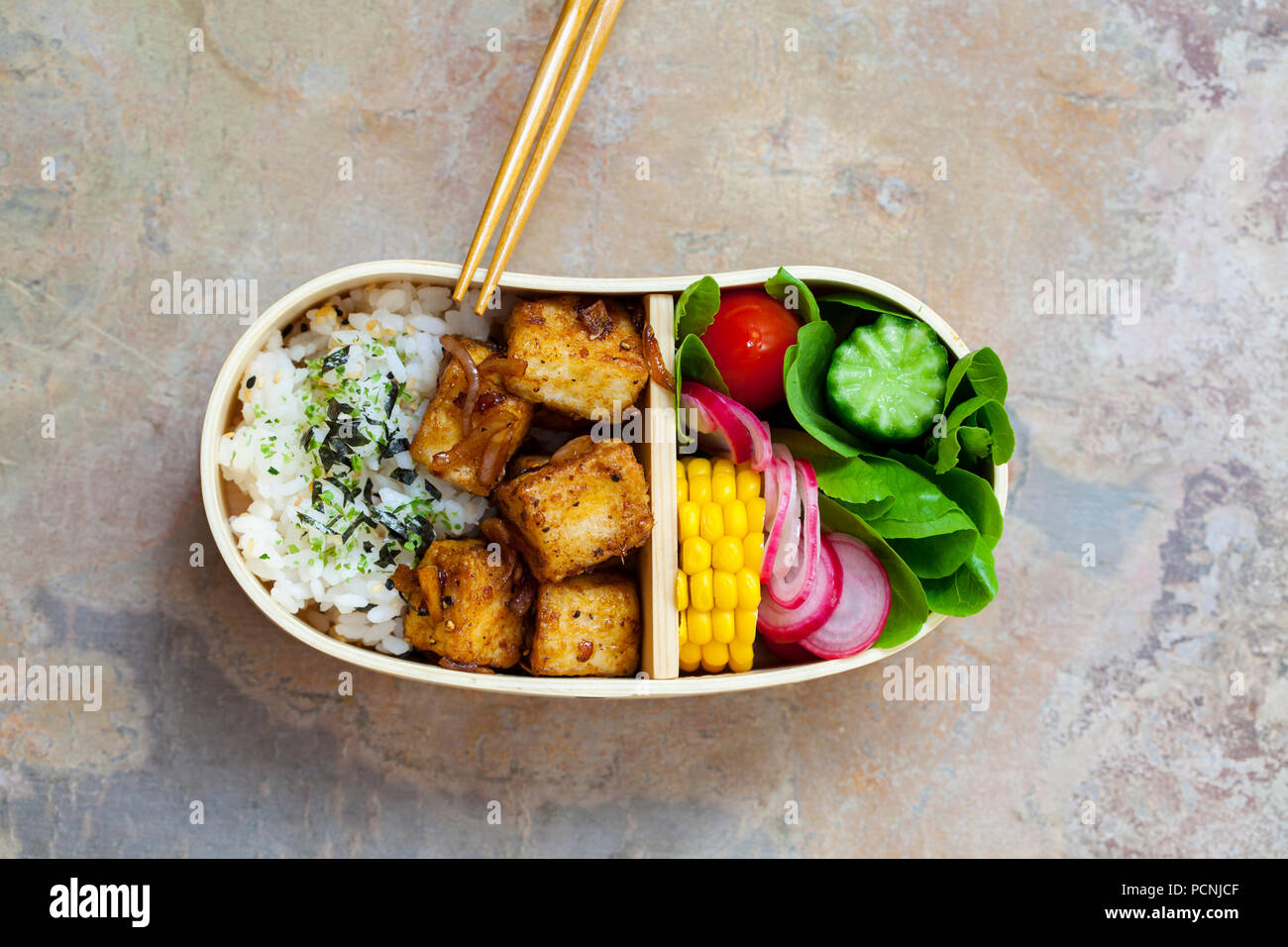 Crispy tofu with rice and salad in bento box Stock Photo - Alamy