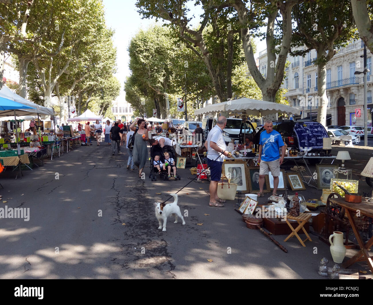 The busy square in Beziers is the scene of a sunny summers day as they hold one of their weekly ...