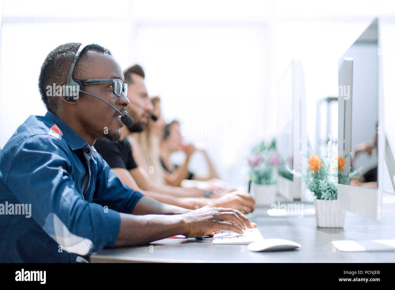 call center staff sitting at the Desk Stock Photo - Alamy