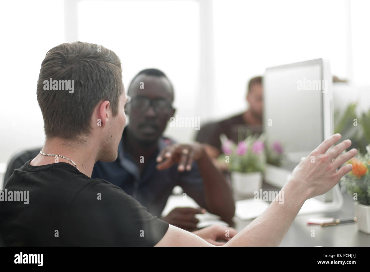 employees sitting at the Desk Stock Photo - Alamy