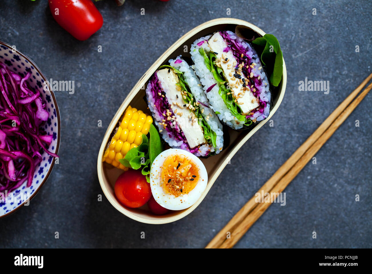 Japanese bento box with tofu onigirazu Stock Photo - Alamy