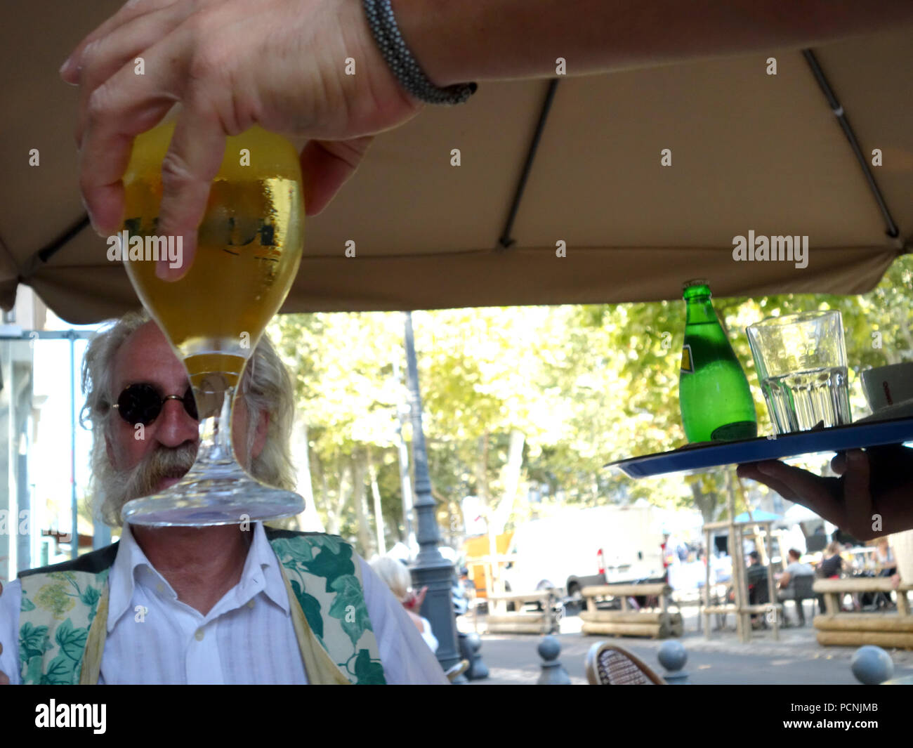 French waiter service to table in outside cafe in France Stock Photo ...