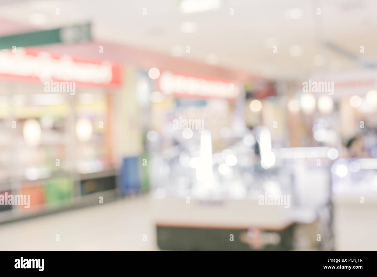 Abstract blur department store with shopping mall interior for ...