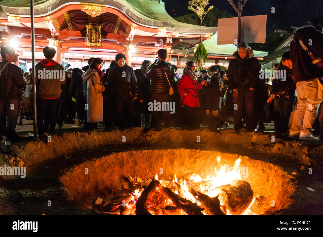 CShogatsu, new year, Nishisnomiya shrine, Japan. People standing around ...