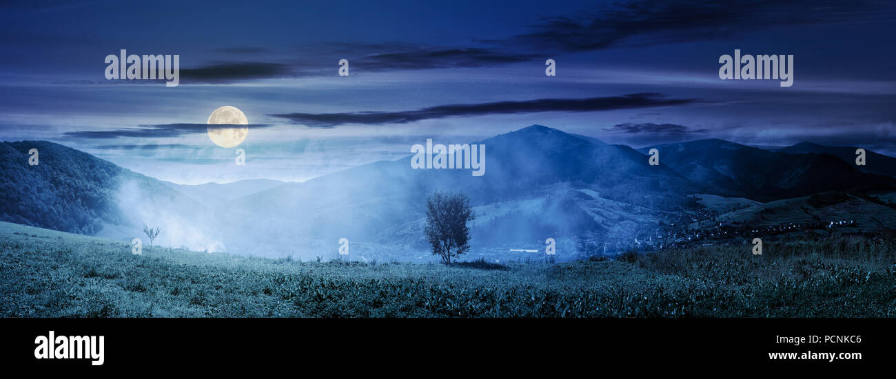 panorama of beautiful mountainous countryside at night in full moon ...