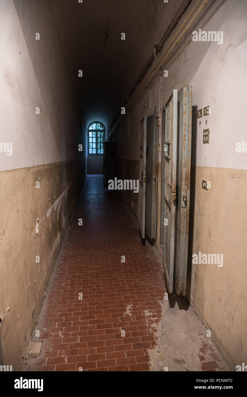 Long Corridor and White and Worn Walls of a Prison Stock Photo - Alamy