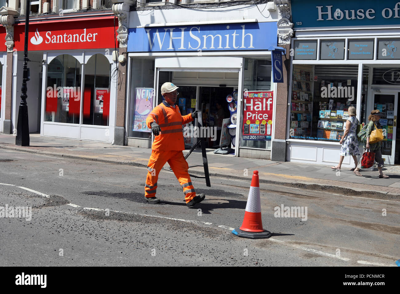 Roadworks resurfacing works in London Stock Photo - Alamy