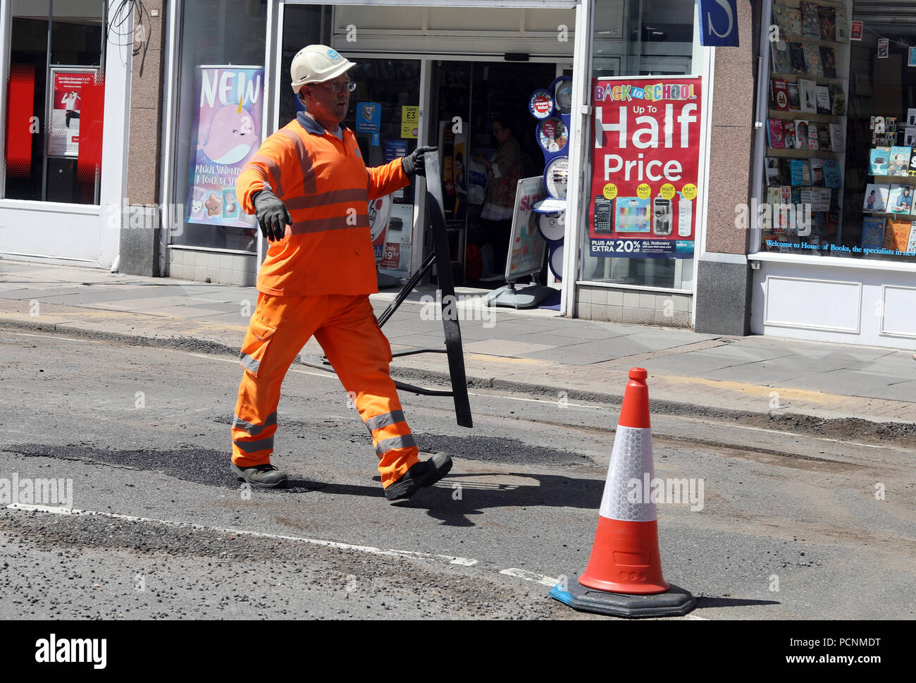 Roadworks resurfacing works in London Stock Photo - Alamy