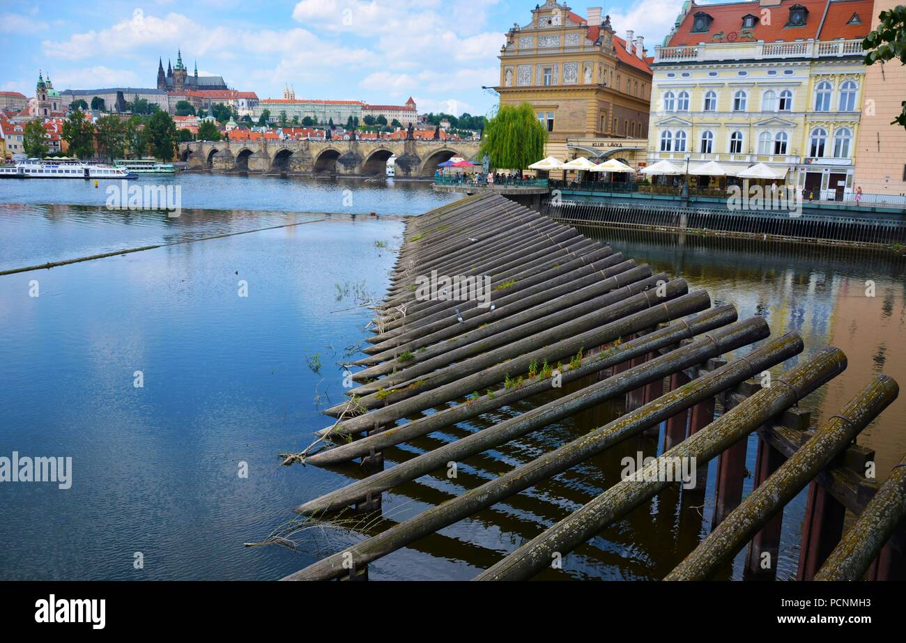 Charles Bridge view and the cityscape from Naplavka u Hergetovy Cihelny ...