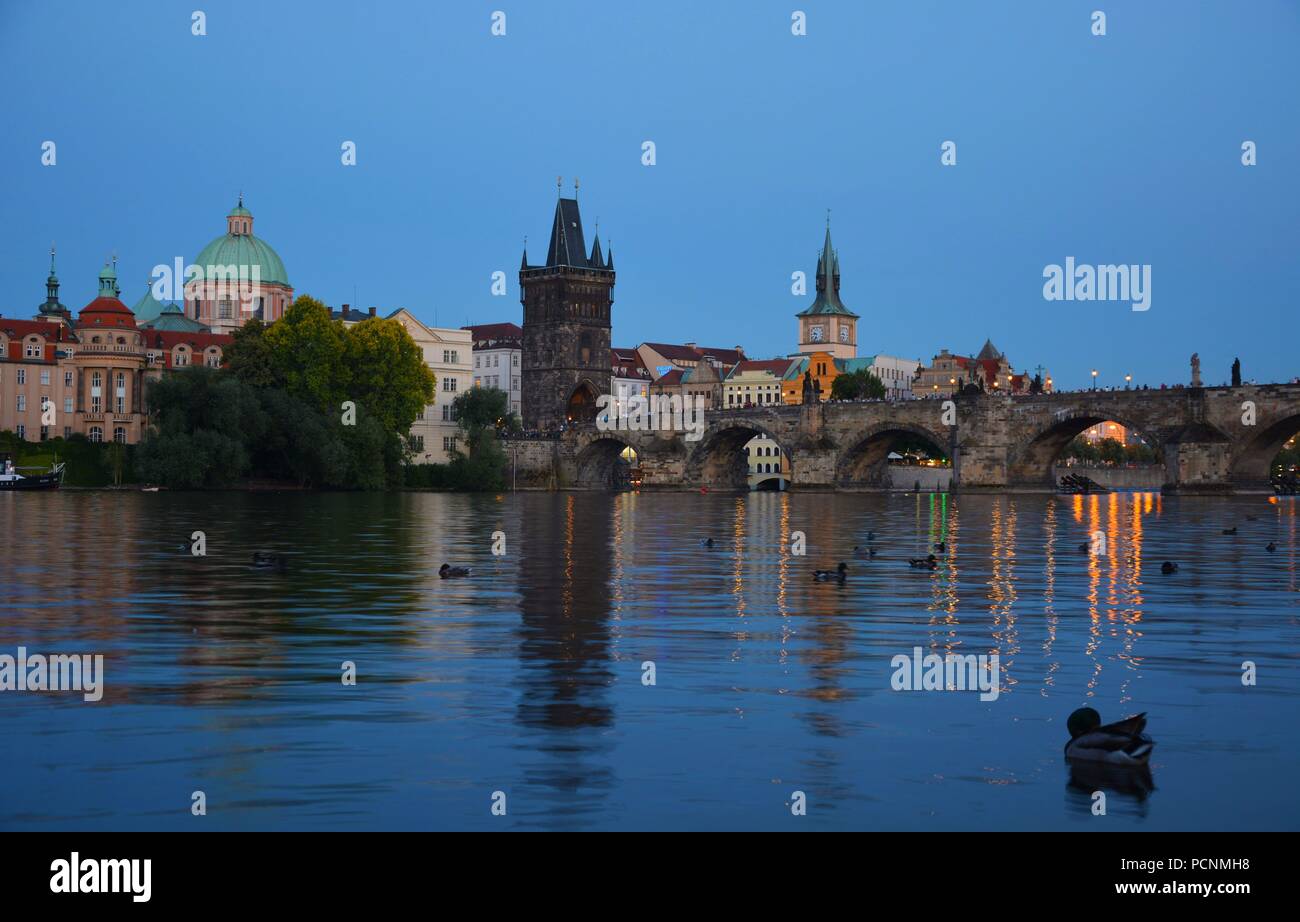 Charles Bridge view and the cityscape from Naplavka u Hergetovy Cihelny ...