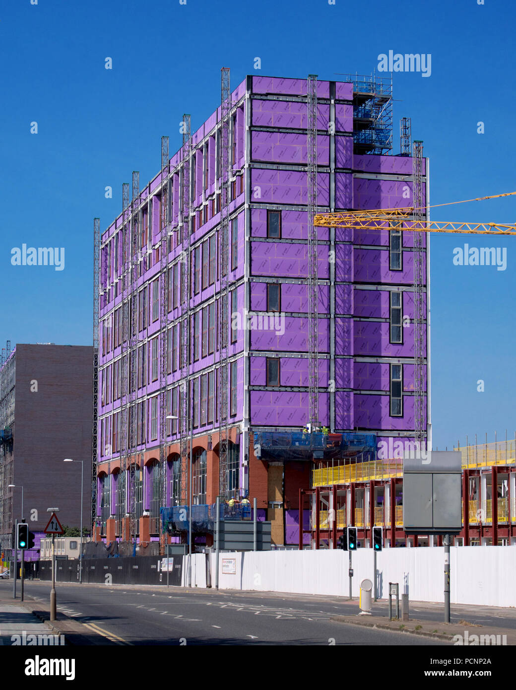 Purple insulation on new building in Manchester Stock Photo - Alamy