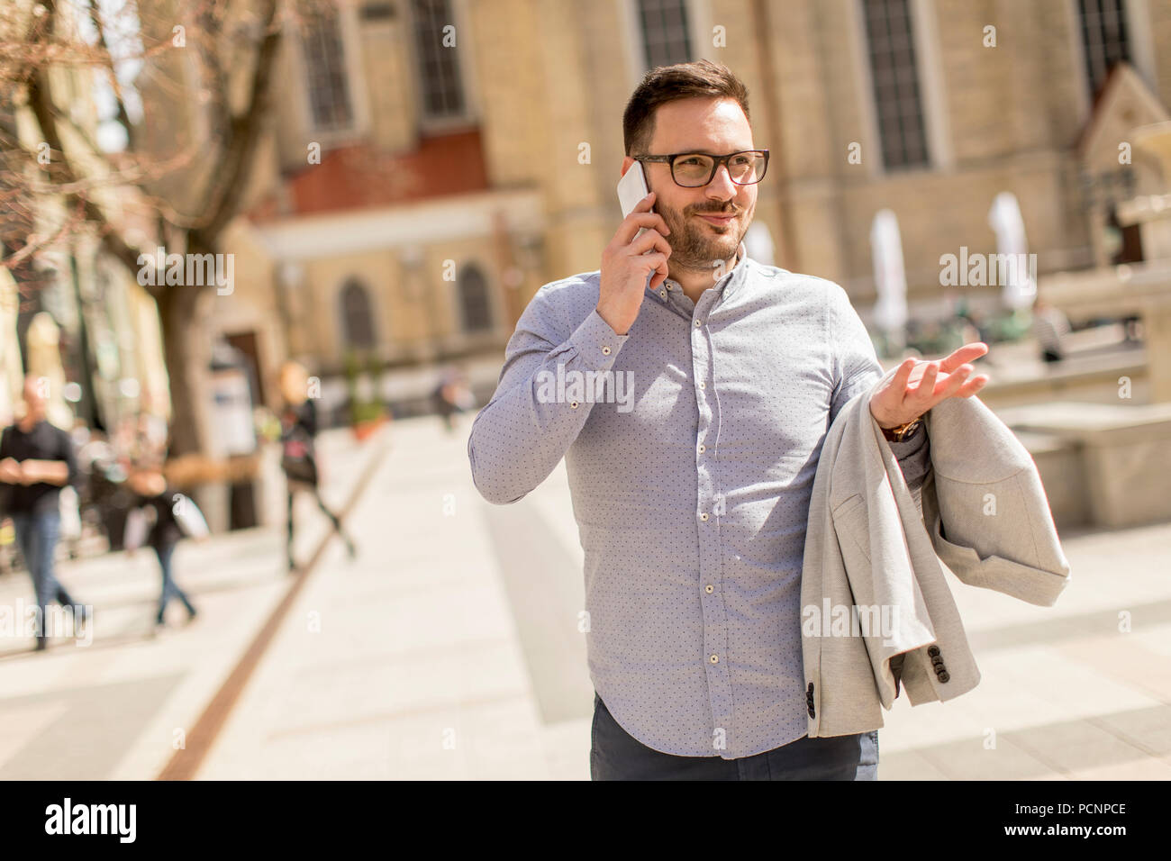 Young man uses smartphone hi-res stock photography and images - Alamy