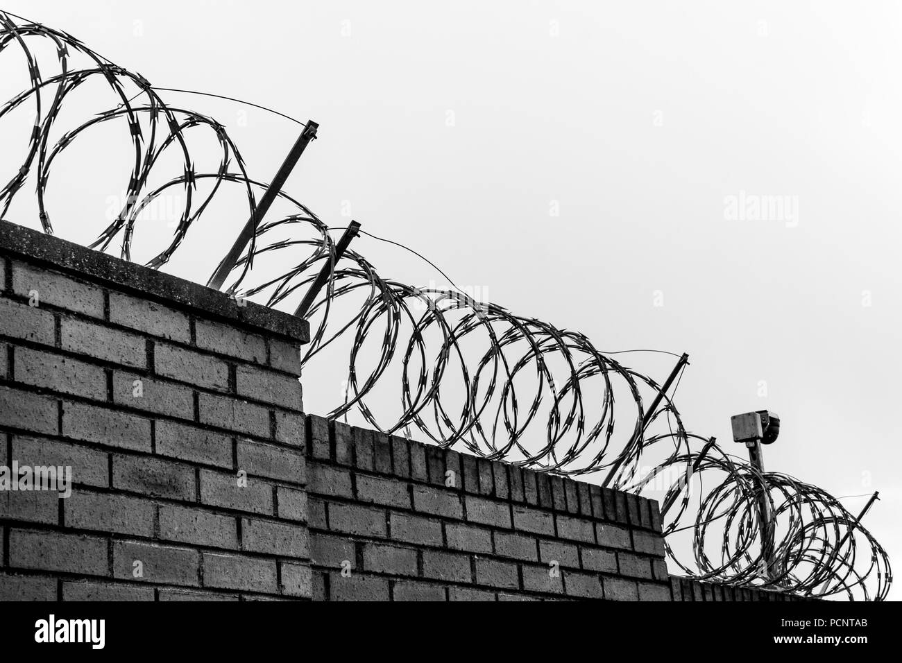 Barrier of razor wire Black and White Stock Photos & Images - Alamy