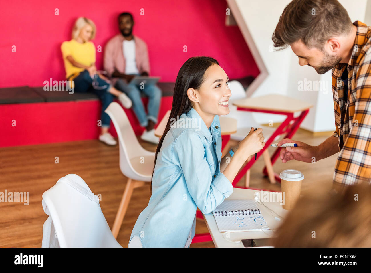happy young students studying together at college Stock Photo - Alamy