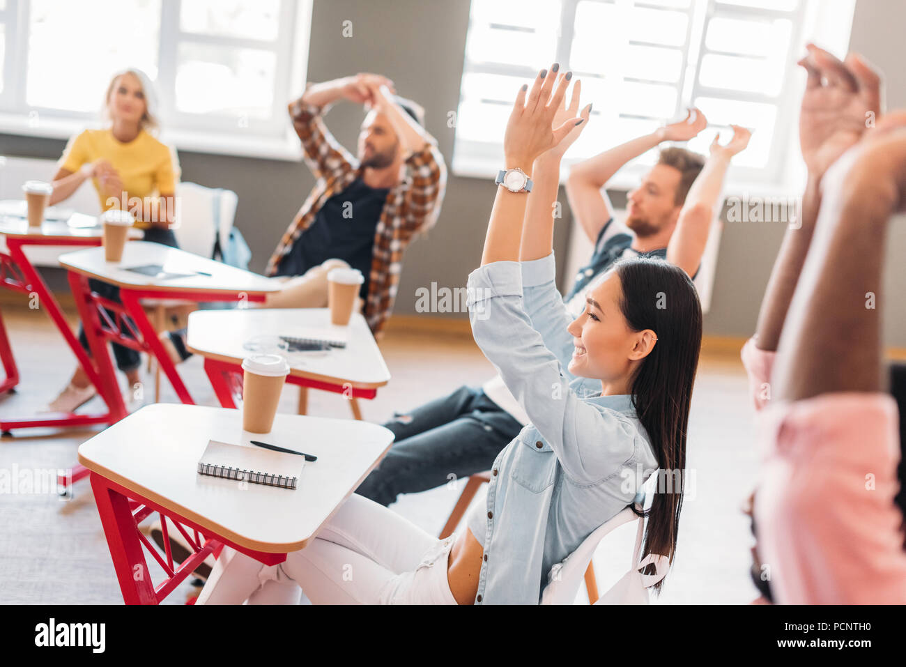 Students clapping in classroom hi-res stock photography and images - Alamy