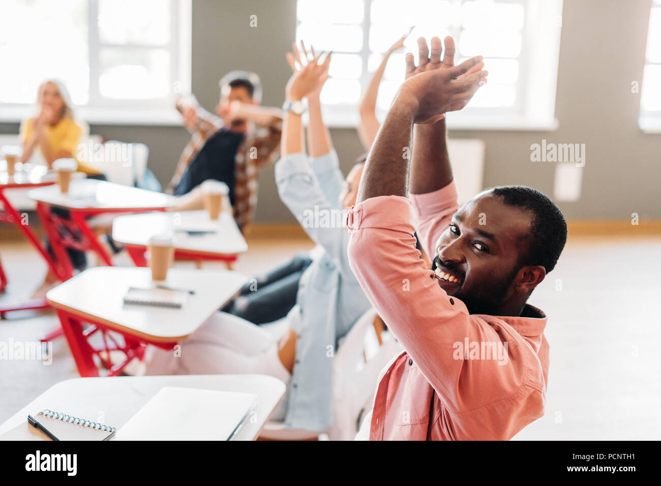 happy young students clapping in classroom toogether Stock Photo - Alamy