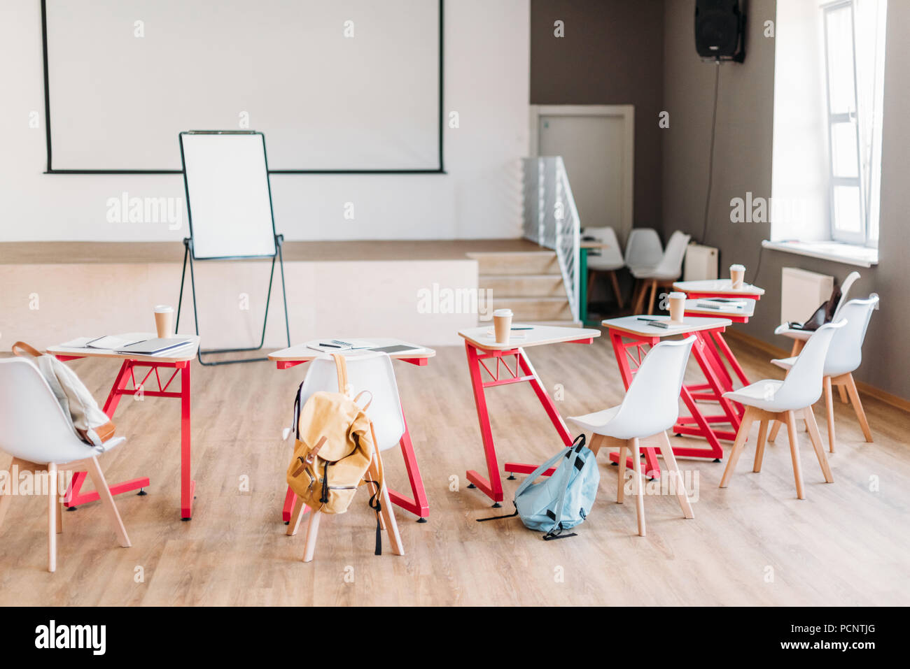 empty college classroom with desks and backpacks of students Stock ...