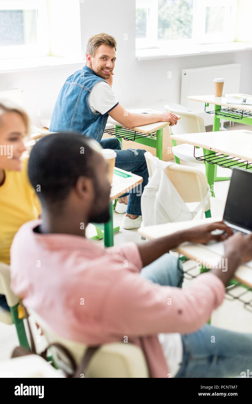 young students sitting at classroom during lesson Stock Photo - Alamy