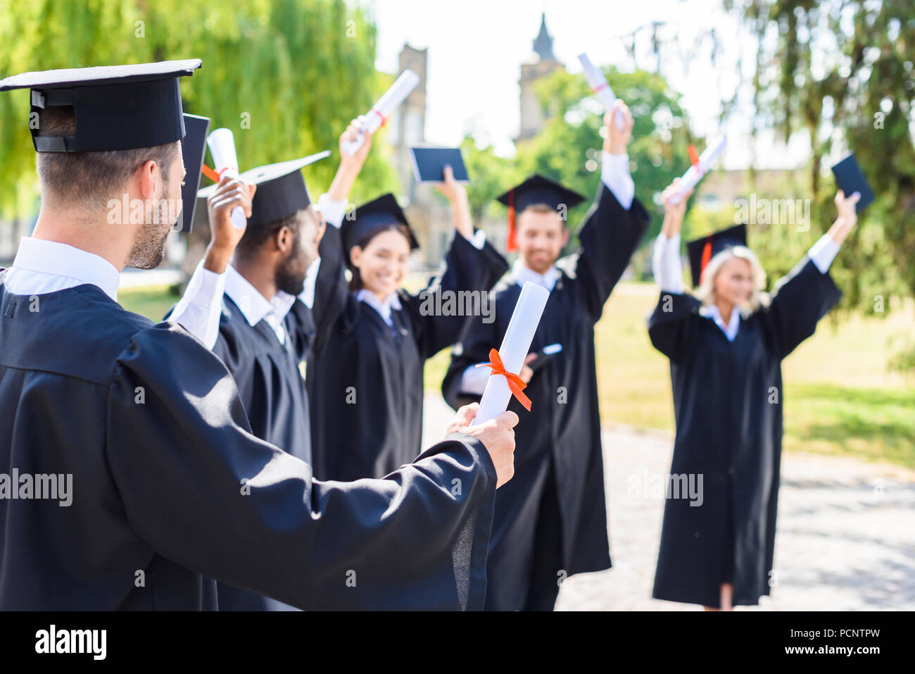 Happy students celebrating hi-res stock photography and images - Alamy