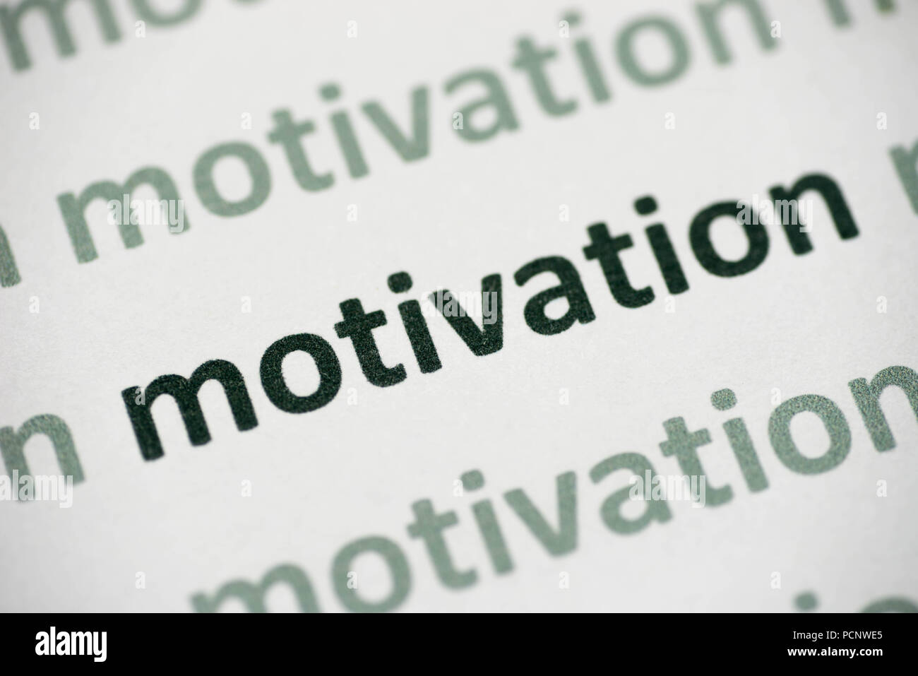 word motivation printed on white paper macro Stock Photo - Alamy