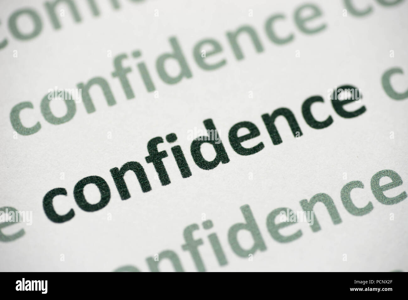 word confidence printed on white paper macro Stock Photo - Alamy