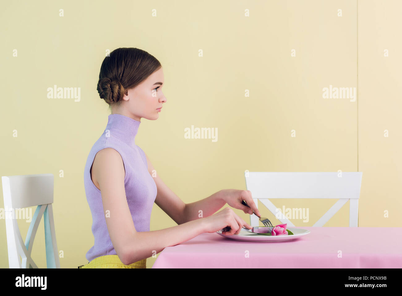 beautiful youth girl eating tulip flower, diet concept Stock Photo - Alamy