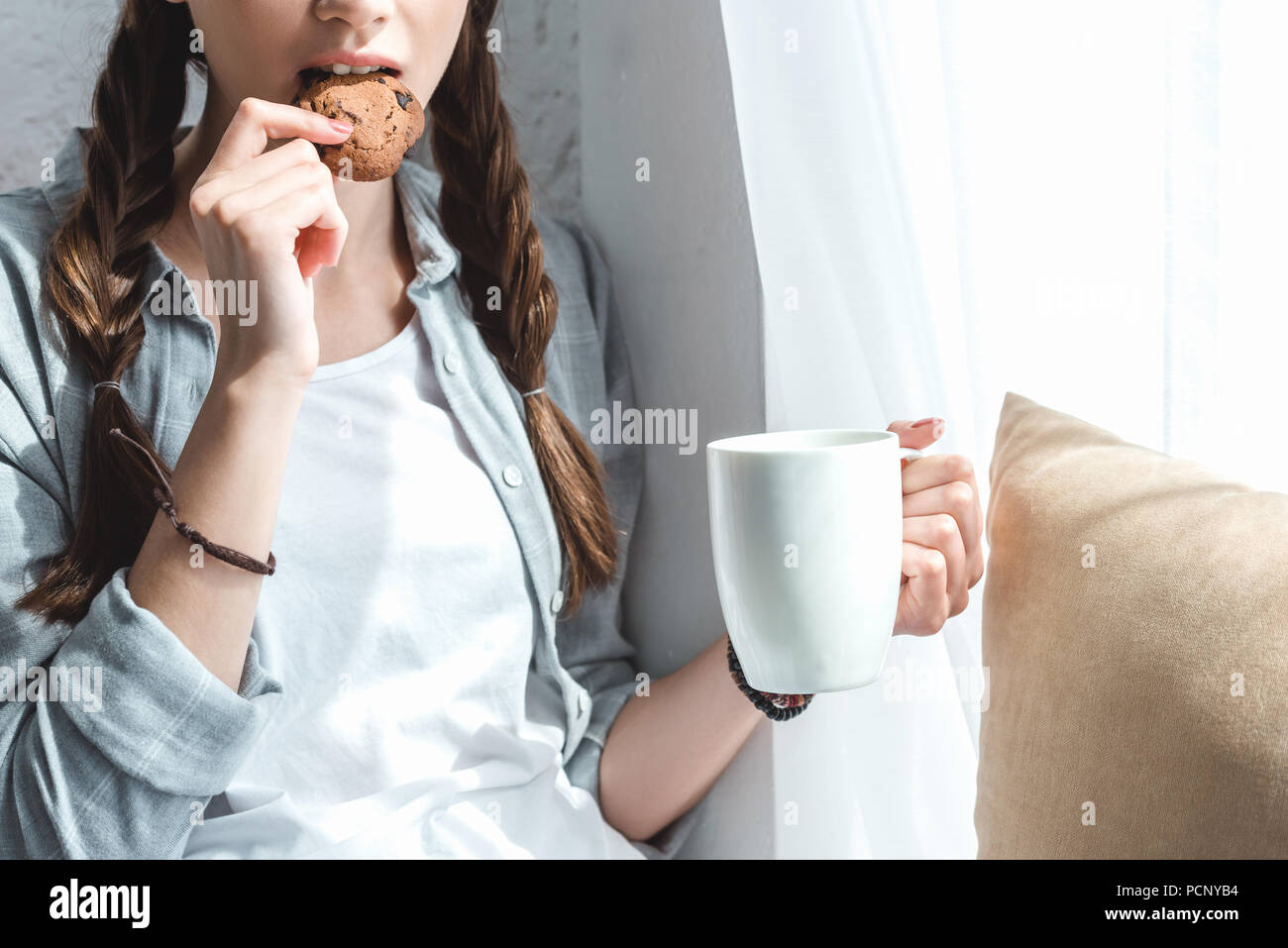 Girl eating cookie hi-res stock photography and images - Alamy