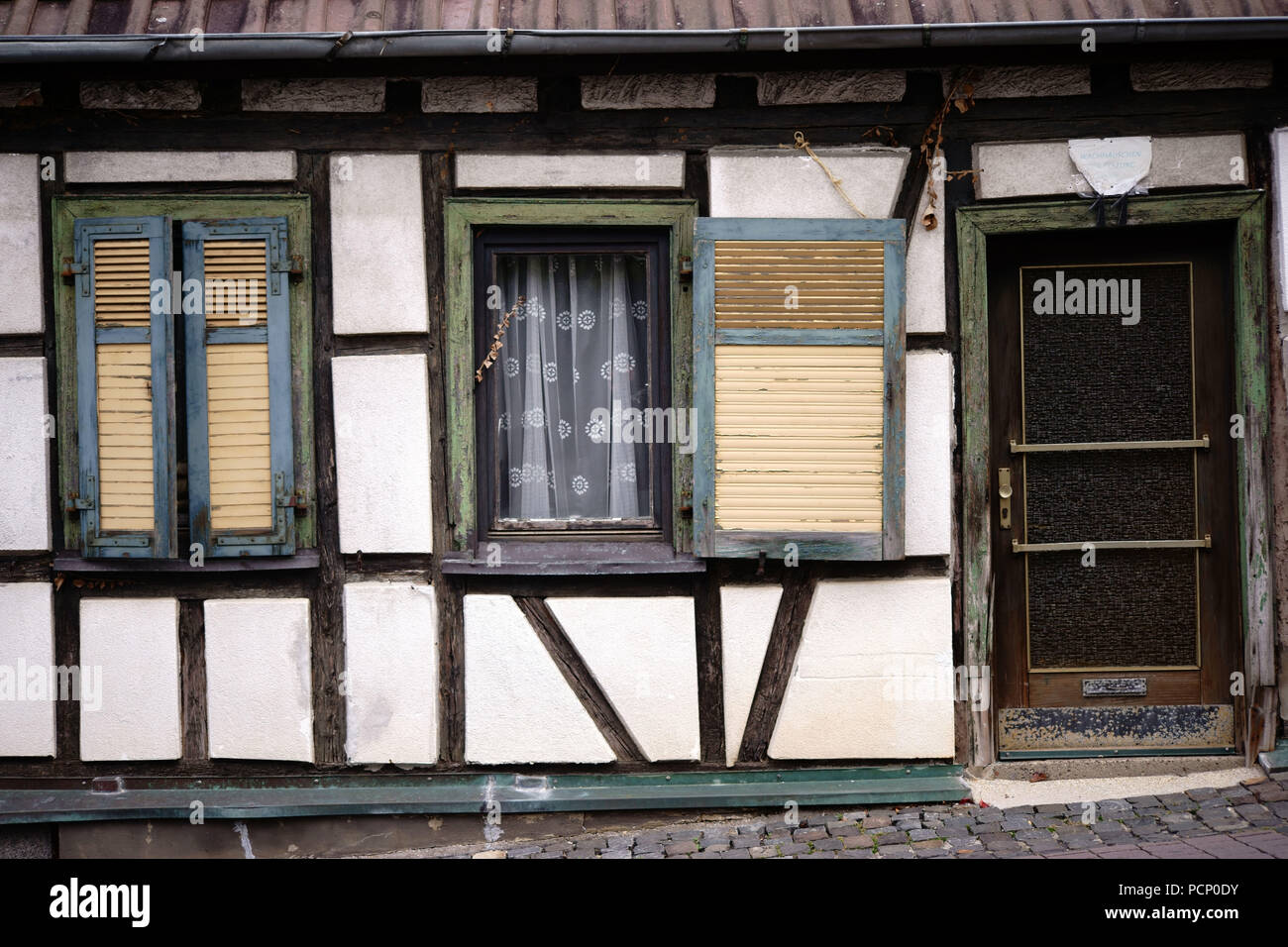 An old unsteady half timbered house with a striking beam construction ...