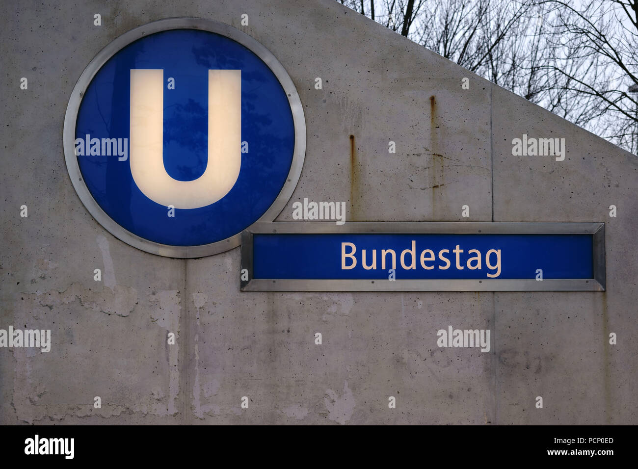 A round blue subway sign of the subway station 'Bundestag' on a ...