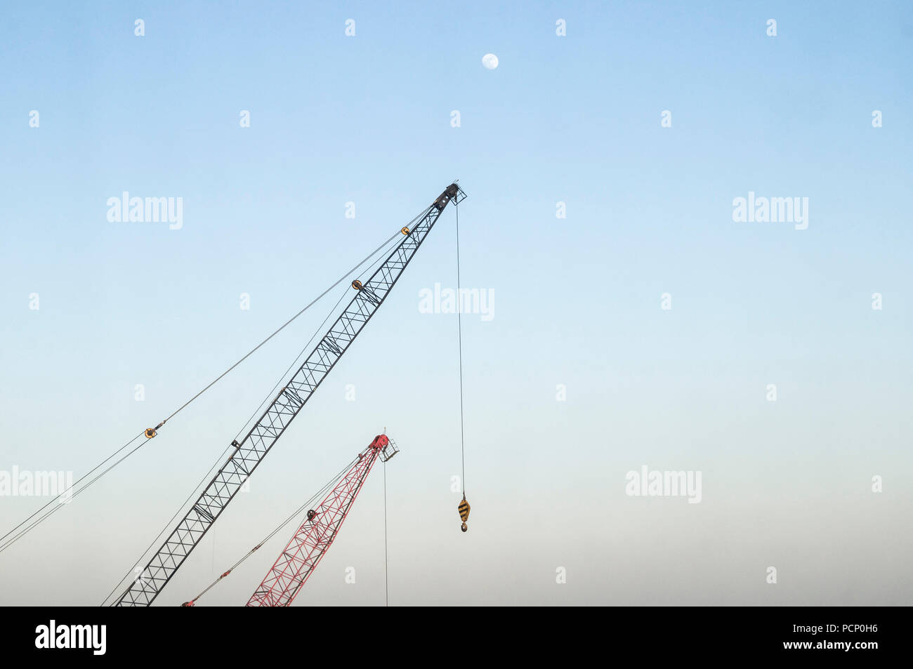 Two construction cranes hi-res stock photography and images - Alamy