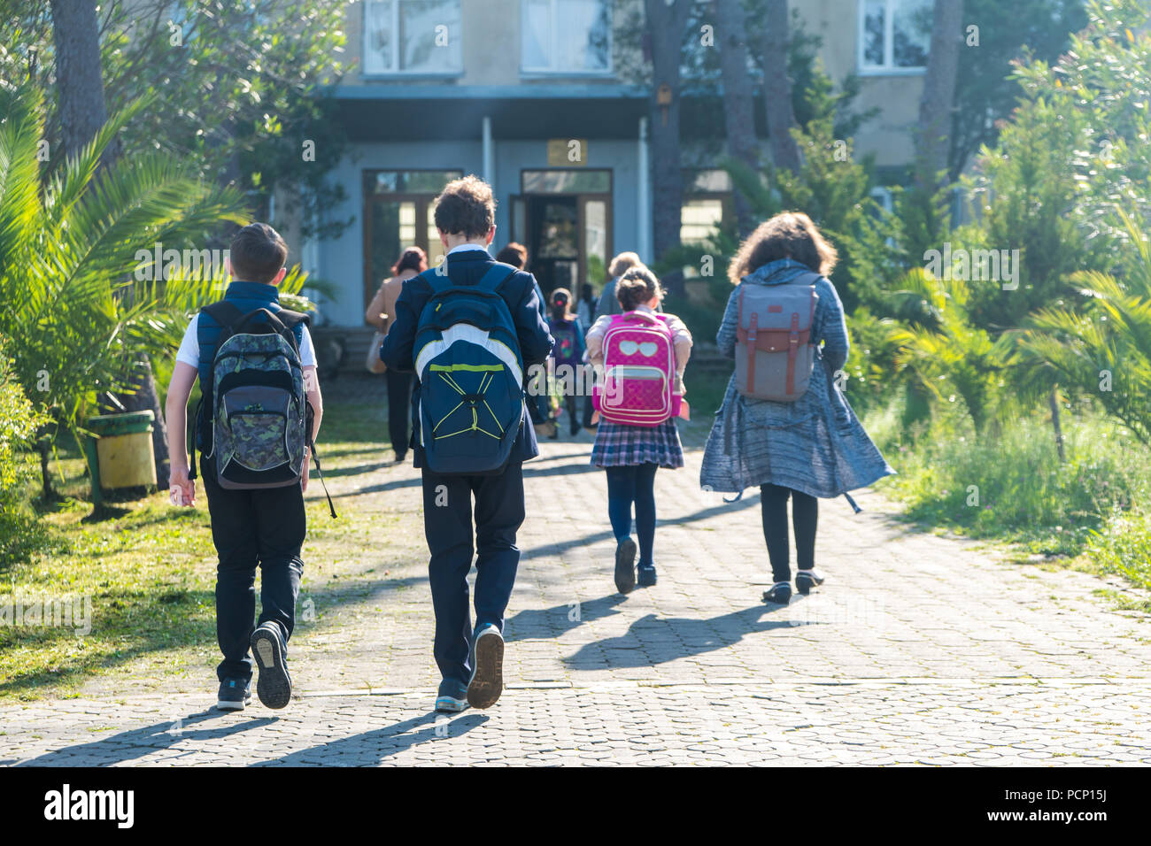 Group of kids going to school, education Stock Photo - Alamy