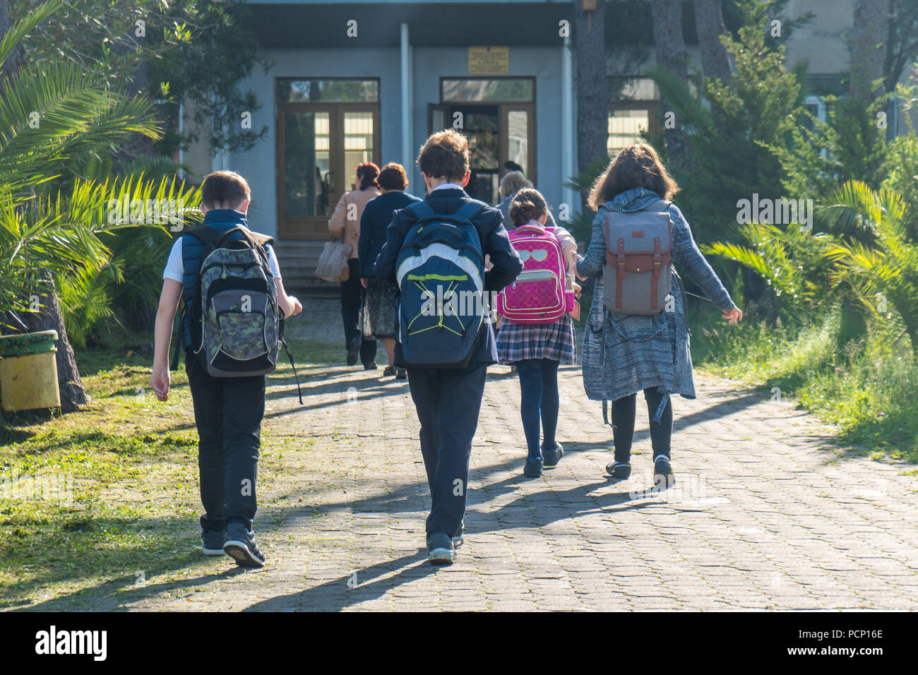 Group of kids going to school, education Stock Photo - Alamy